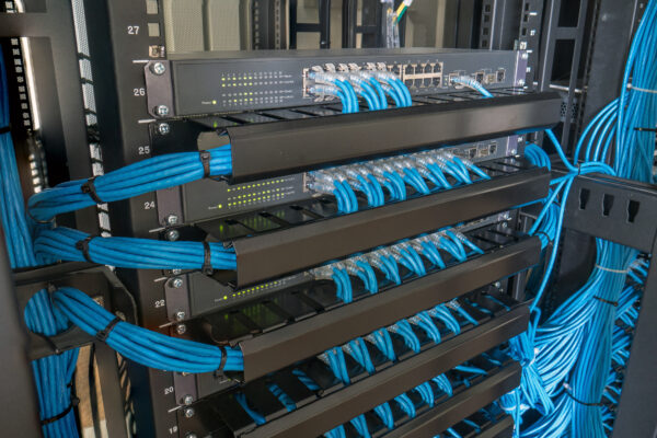 Network switch and ethernet cables in rack cabinet | Telecor ...